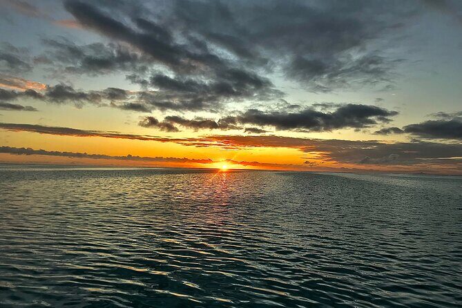 private sunset on the beautiful bora bora lagoon - The Sum Up