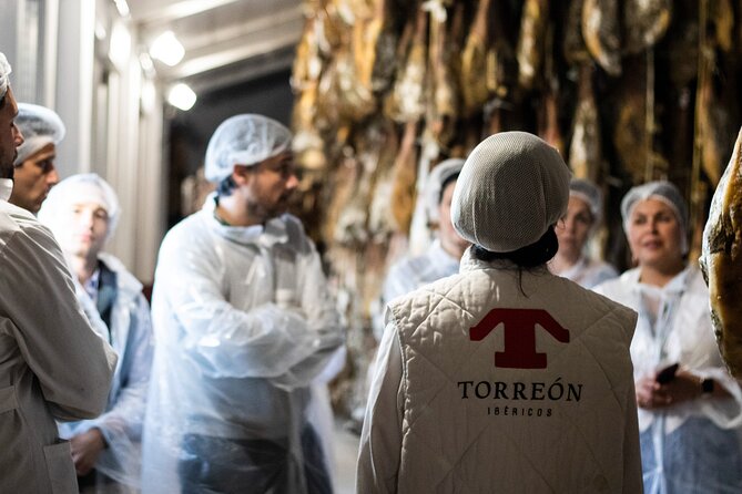 Private Visit to a Ham Factory With Show Cooking in Salamanca - Meeting and Pickup