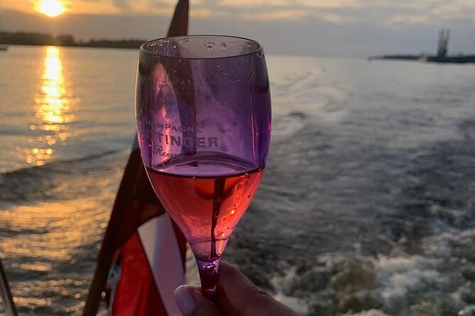 Riga: Evening or Sunset Boat Tour with Drink and Audio Guide - Who Should Consider This Tour?