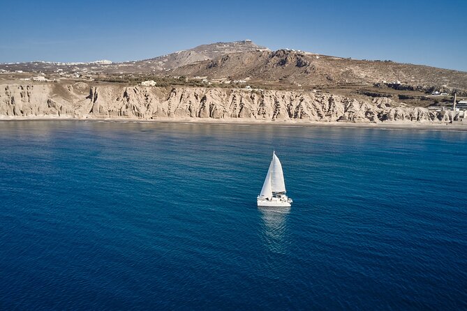 Santorini: Caldera Private Catamaran Cruise with Meal & Drinks - White Beach: A Coastal Gem