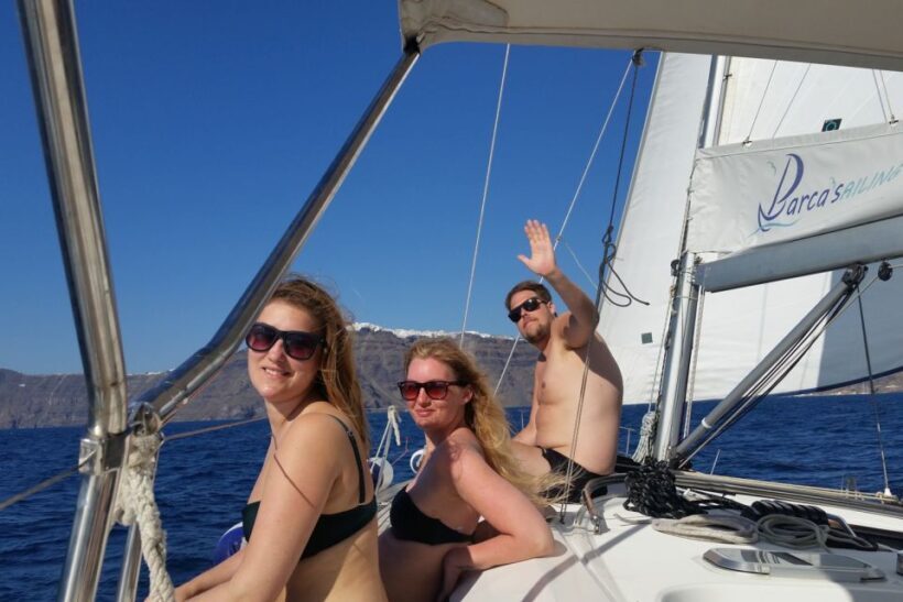 Santorini Caldera: Sunset Sailing Cruise with Meal - Volcanic Beaches and Akrotiri Lighthouse