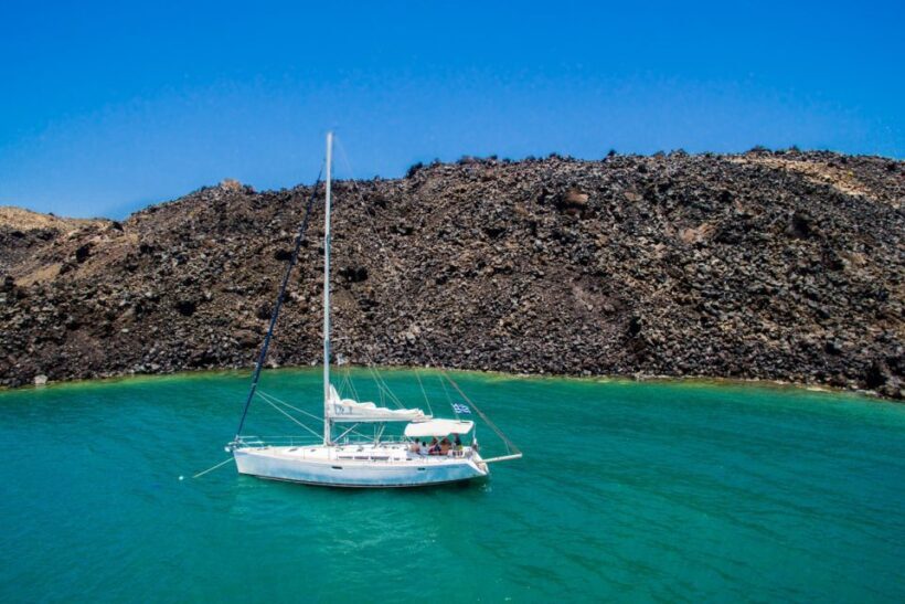 Santorini Caldera: Sunset Sailing Cruise with Meal - Sunset and Return: An Ending to Cherish