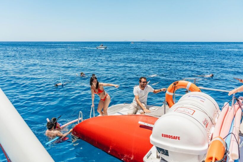 Santorini: Catamaran Tour with BBQ Dinner, Drinks, and Music - Key Points