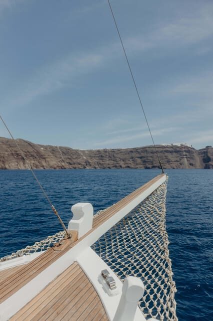 Santorini: Ios Island Overnight Sailing Trip with Meals - Key Points