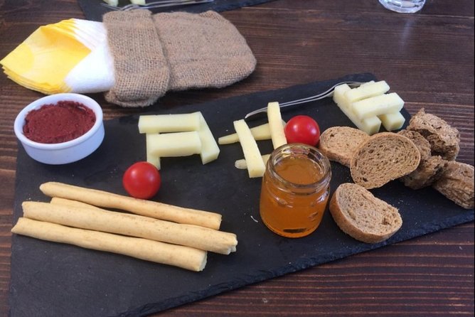 Santorini Private Cooking Class and Wine Tasting Tour - Combining Wine Tasting and Culinary Adventure