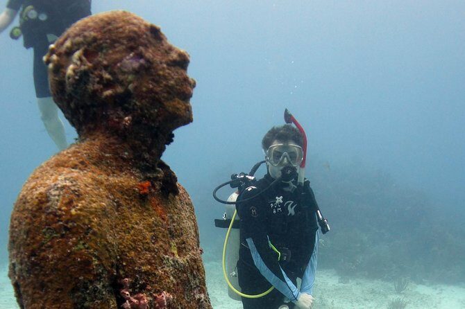 Scuba diving at MUSA the underwater museum for certified divers - Source: Viator MUSA Underwater Museum Tour