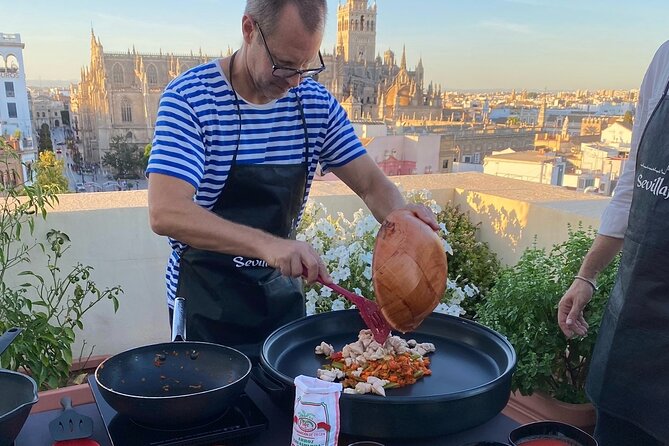 Sevilla: Panoramic Highlights Rooftop Tour & Paella Cooking Class - Booking and Pricing Details