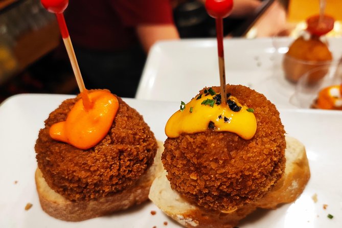 Spanish Wine and Tapas Tour in a Local Neighborhood in Barcelona - Unique Bars and Authentic Experiences