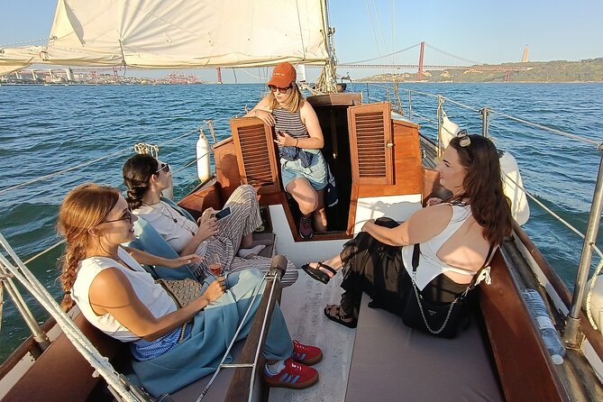 Sunset sailing boat trip in Lisbon with snacks - The Crew and Atmosphere
