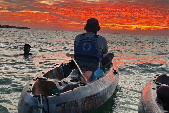 Sunset toast and bioluminescence in clear kayak - Key Points