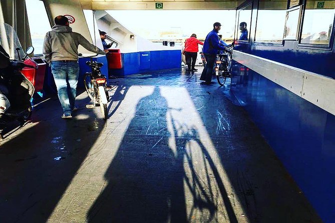 Urban Adventures Amsterdam Bike Tour, Graffiti and Magnet Fishing - Traveling by Ferry to Amsterdam Noord