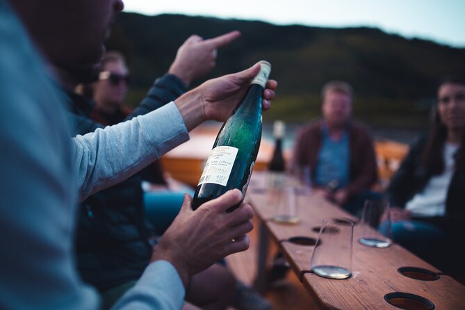Wine tasting on traditional wooden boats in Wachau Valley - Setting Out on the Danube: From Spitz to Dürnstein