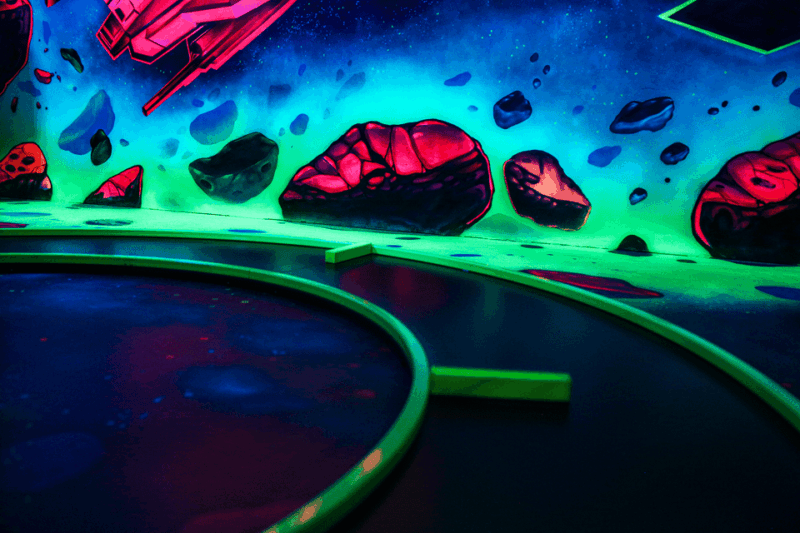 Zurich: Black Light Galaxy Minigolf - Navigating the Asteroid Fields